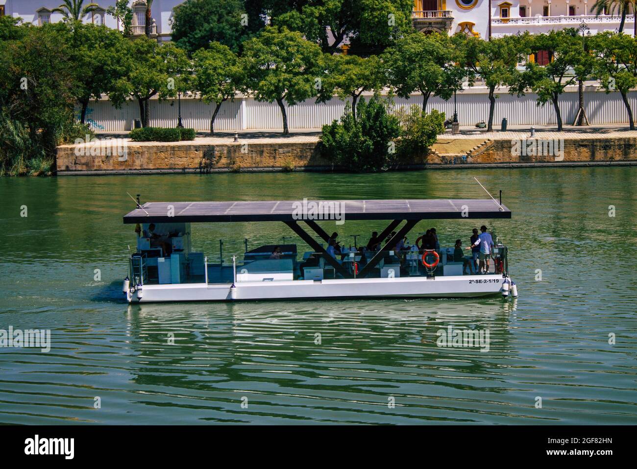 Seville Spain August 21, 2021 Tourist boats on the Guadalquivir River ...