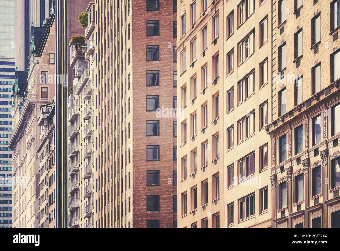 Residential buildings facades, color toning applied, New York City, USA ...