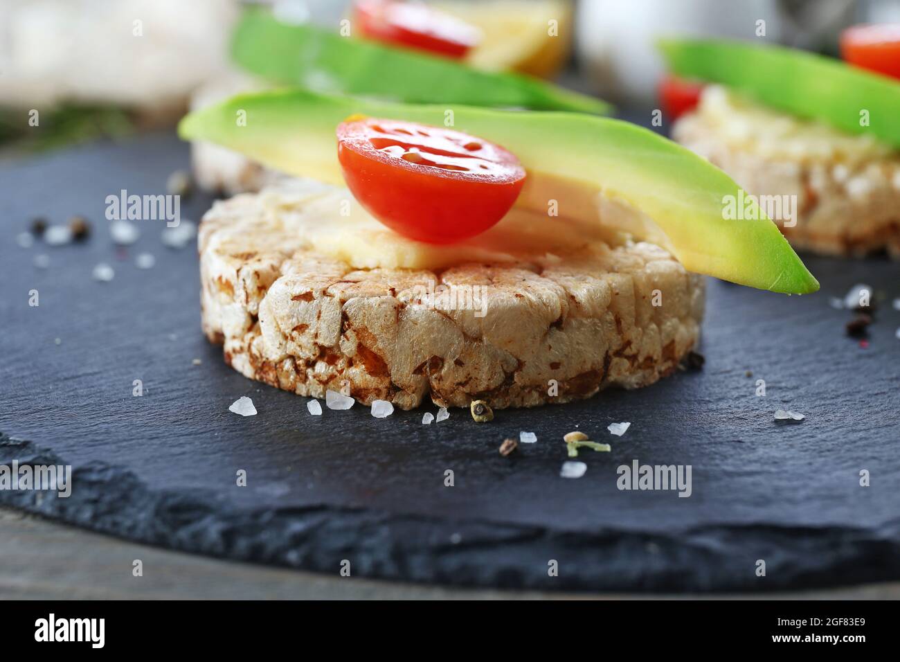 Avocado sandwiches with tomatoes on a mat Stock Photo - Alamy