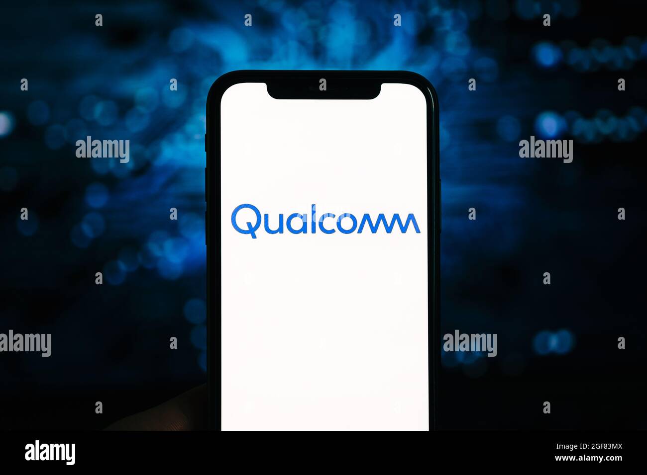 Qualcomm logo on the iPhone screen. Qualcomm is a company that ...