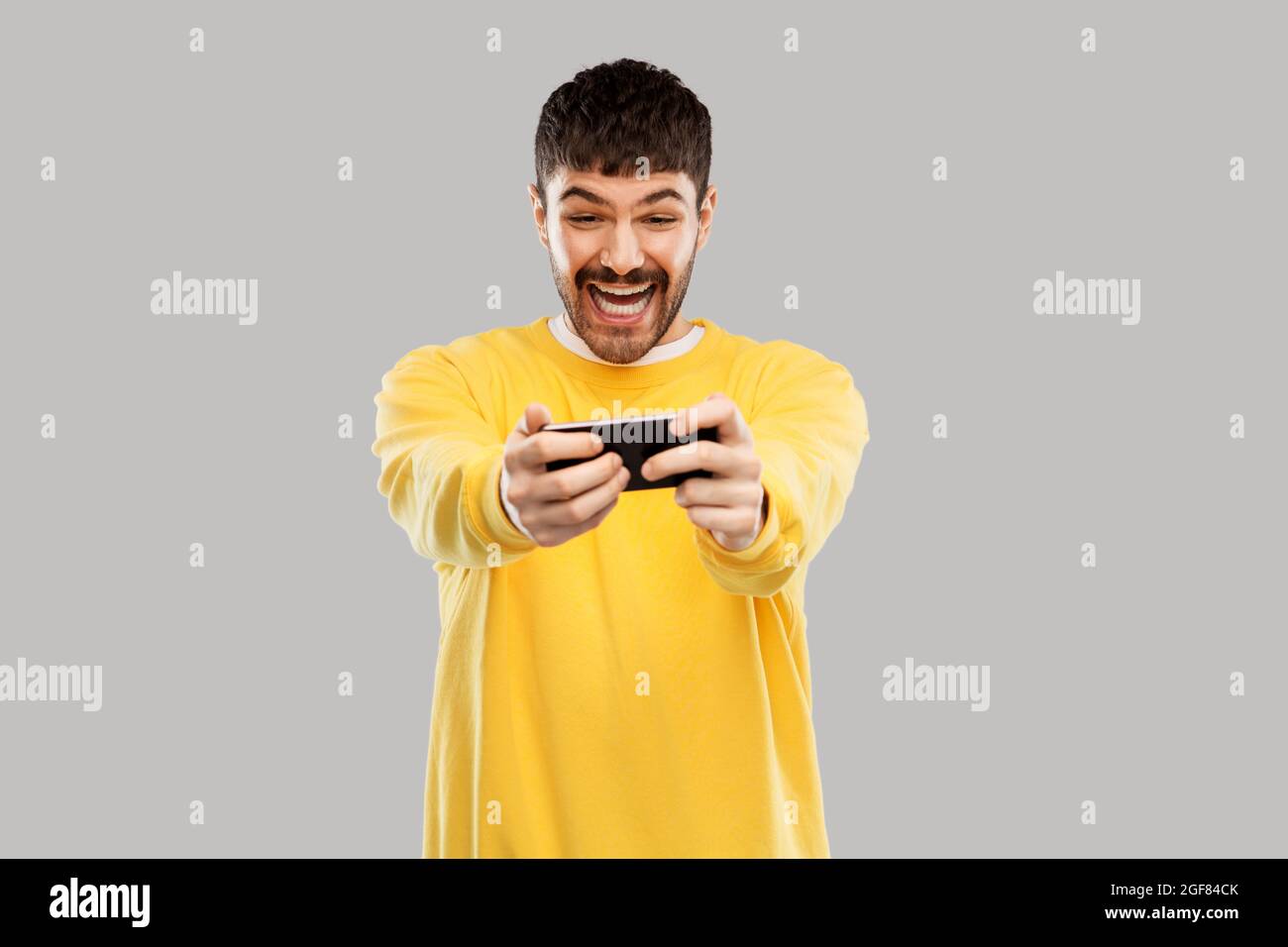 Happy laughing young man hi-res stock photography and images - Alamy