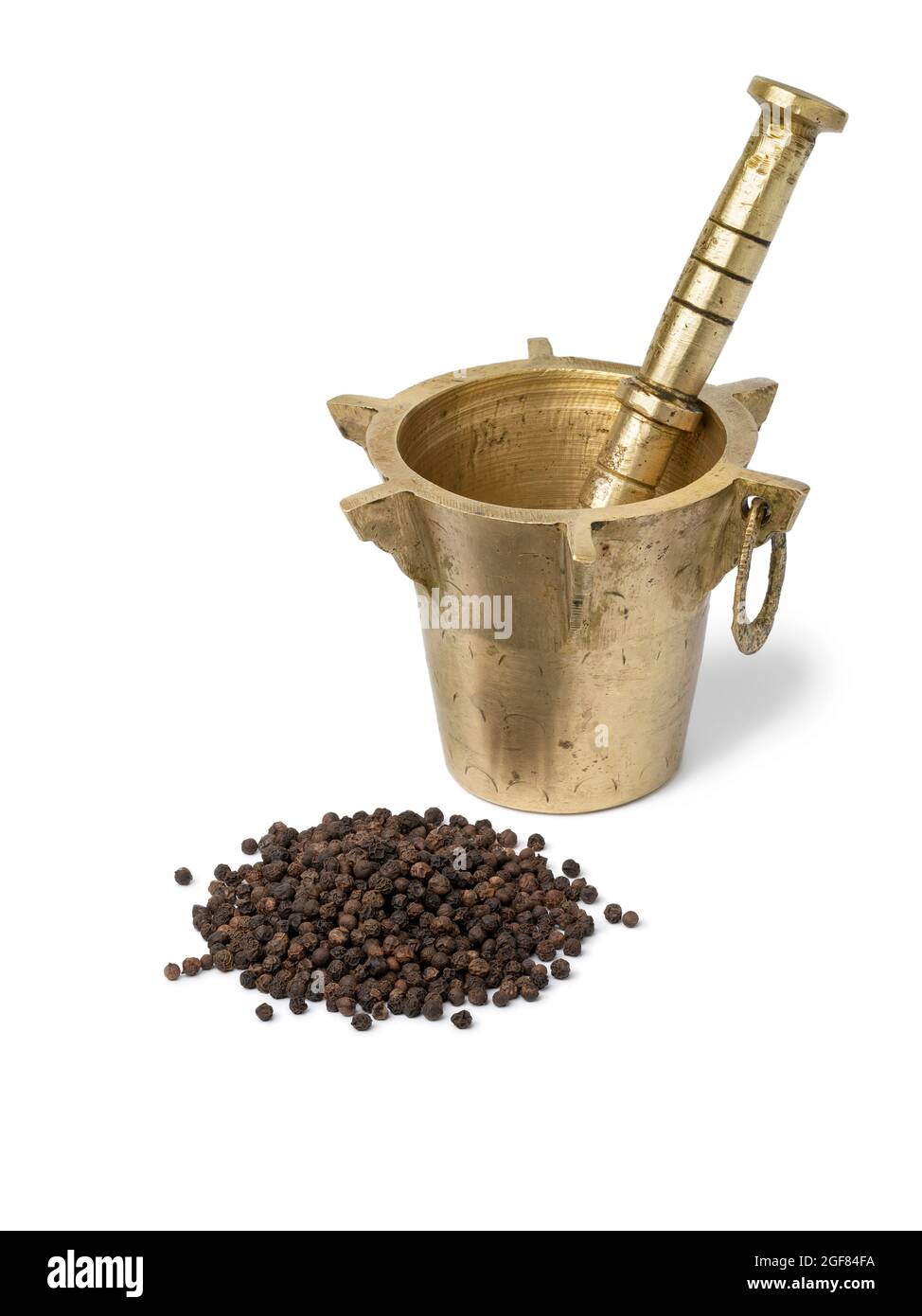 Traditional Moroccan metal Mortar and pestle with a heap of dried black ...