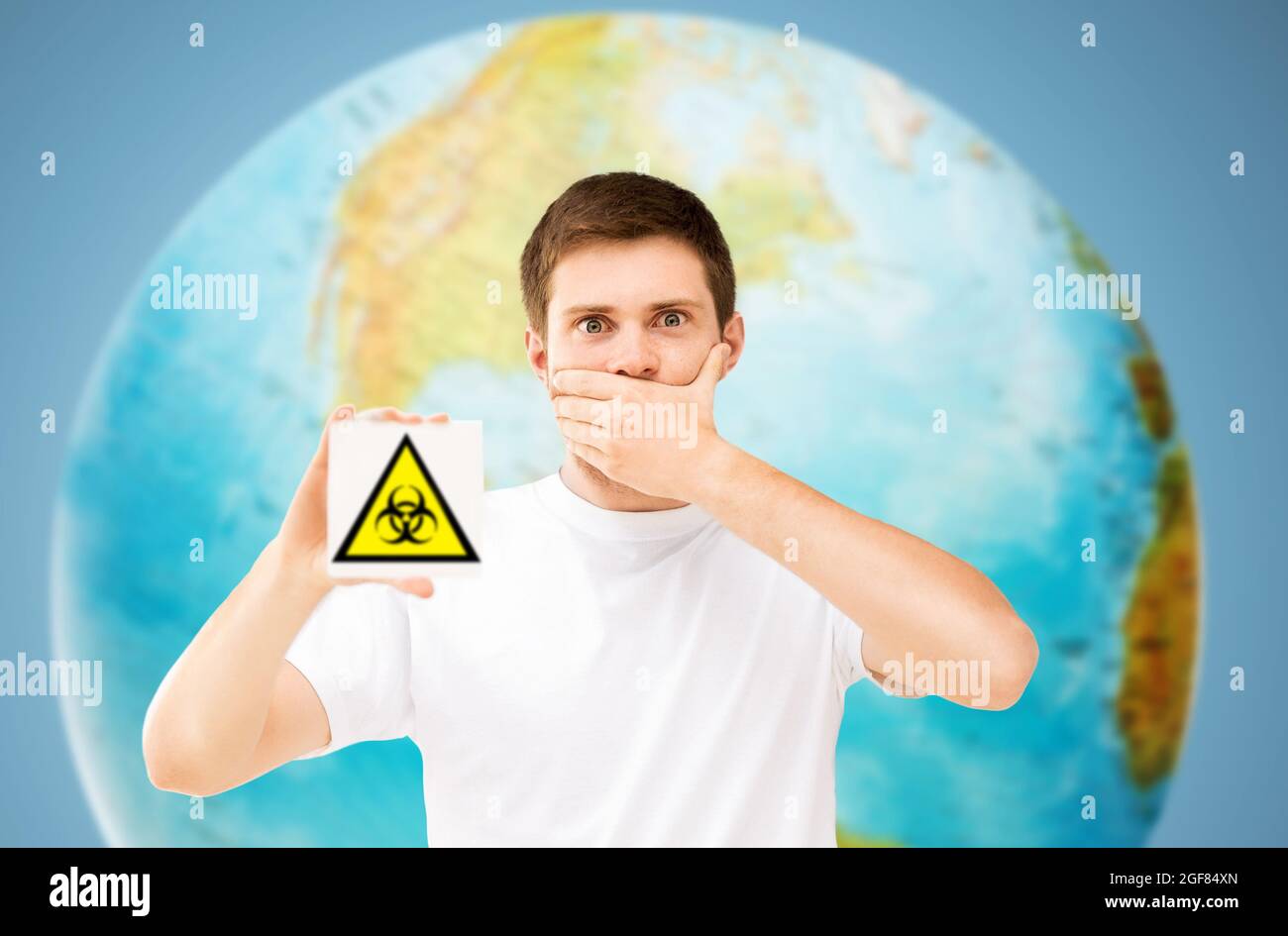 scared man with biohazard sign over earth planet Stock Photo - Alamy