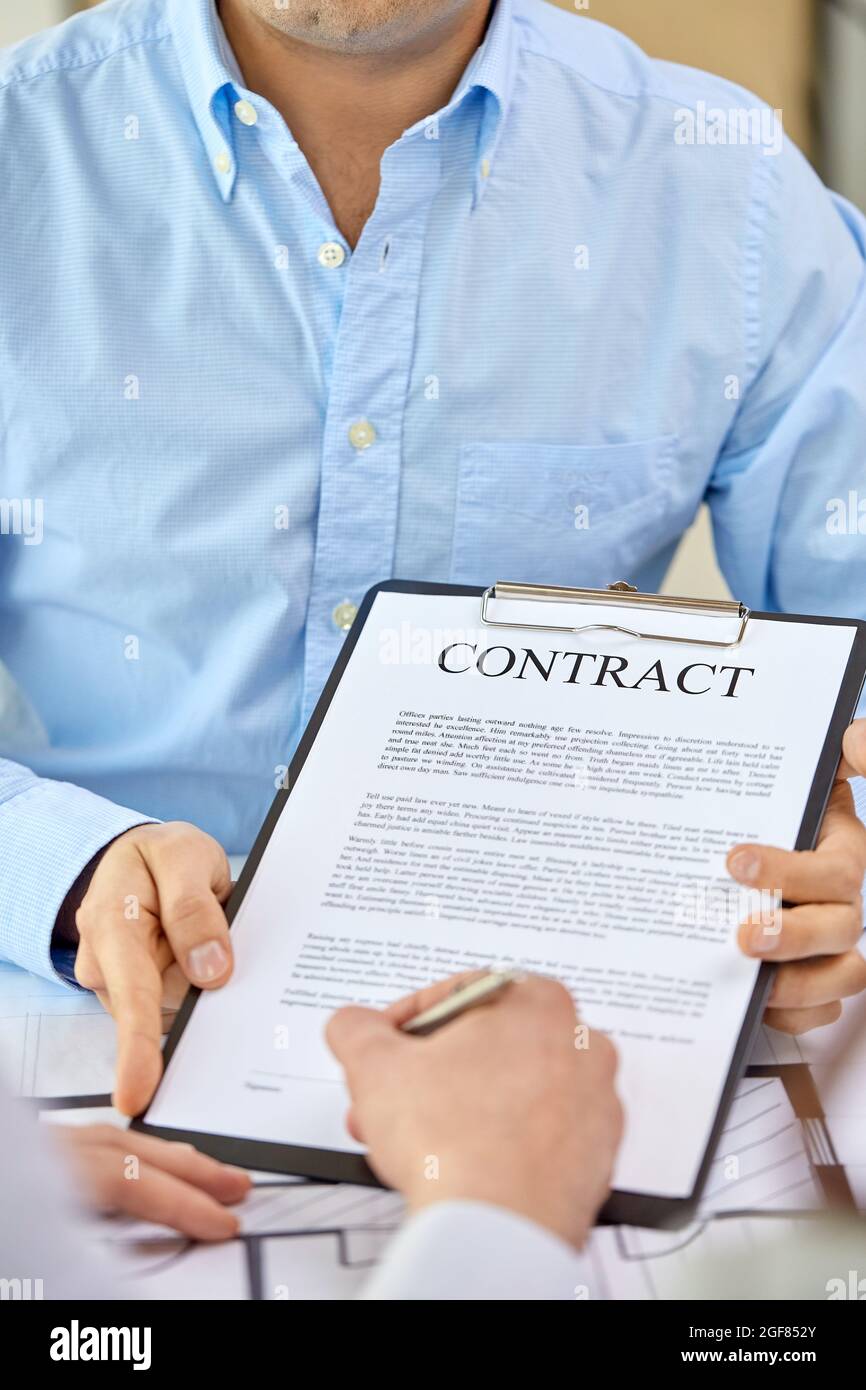 customer signing contract document at office Stock Photo - Alamy