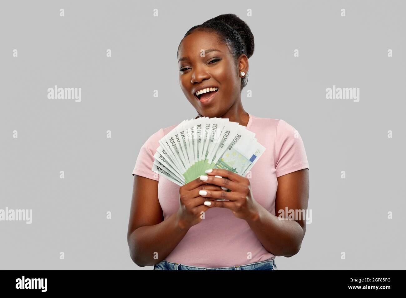 happy african american woman with euro money Stock Photo - Alamy