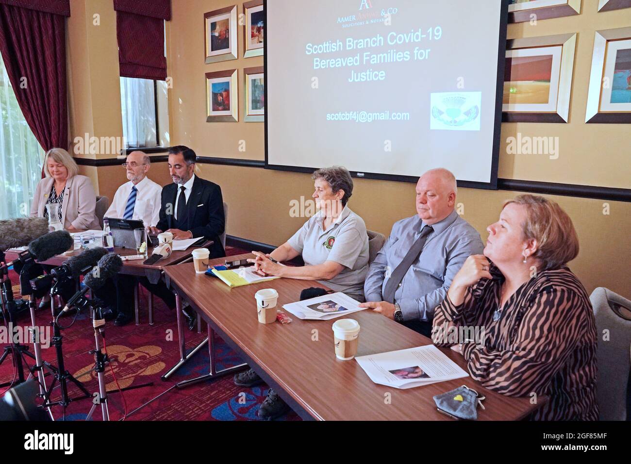 Solicitor Aamer Anwar (third left) and members of the Scottish branch ...