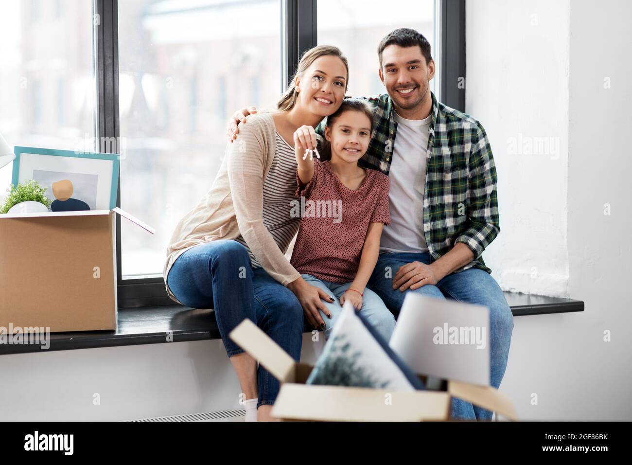 happy family with house keys moving to new home Stock Photo - Alamy