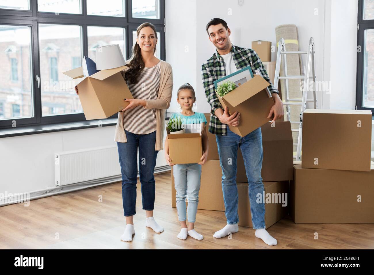 happy family with child moving to new home Stock Photo - Alamy