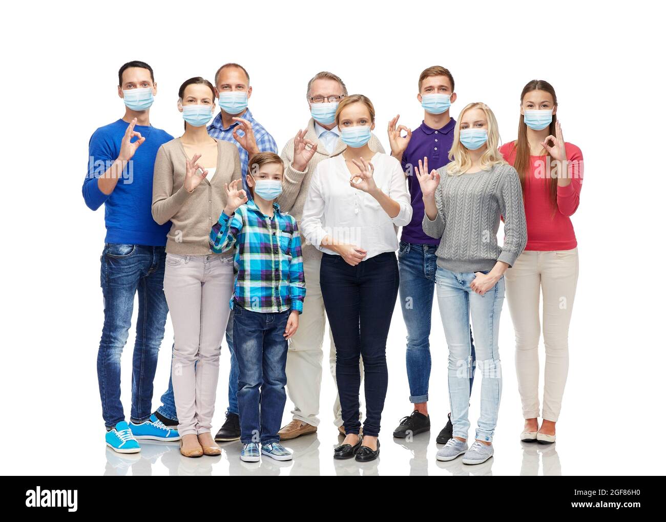 people in medical masks showing ok hand sign Stock Photo - Alamy