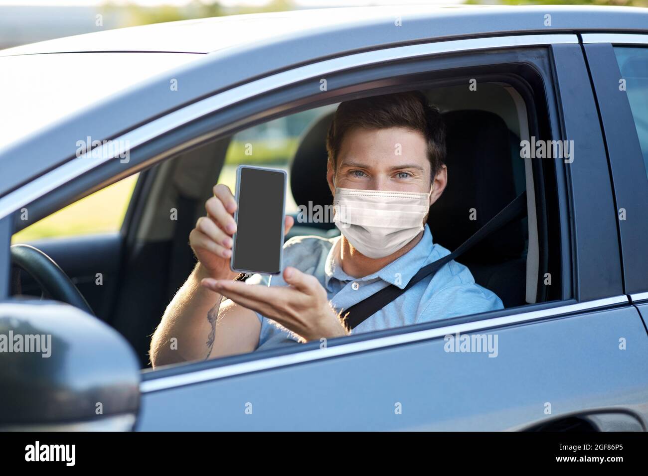 Driver wearing safety mask hi-res stock photography and images - Alamy