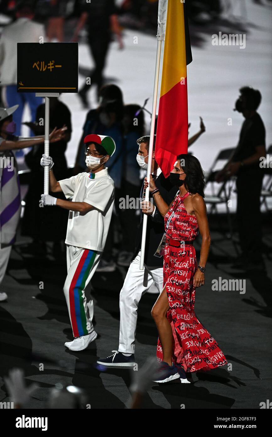 Goalball player Bruno Vanhove and Belgian jockey Michele George hold ...