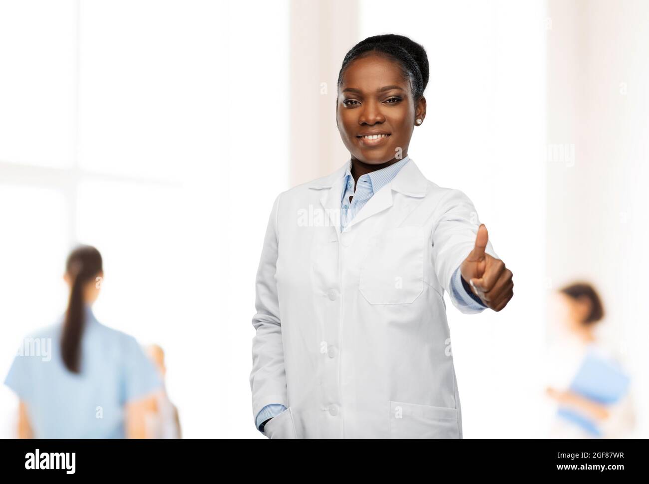 african american female doctor showing thumbs up Stock Photo - Alamy