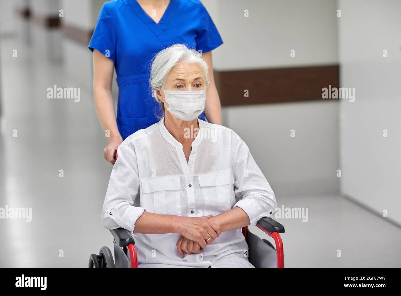 Person in wheelchair with mask hi-res stock photography and images - Alamy