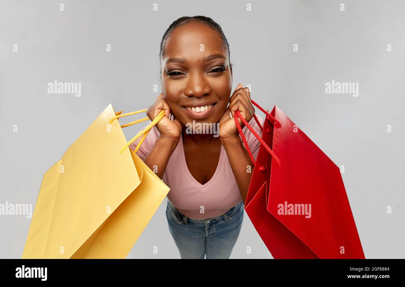happy african american woman with shopping bag Stock Photo - Alamy
