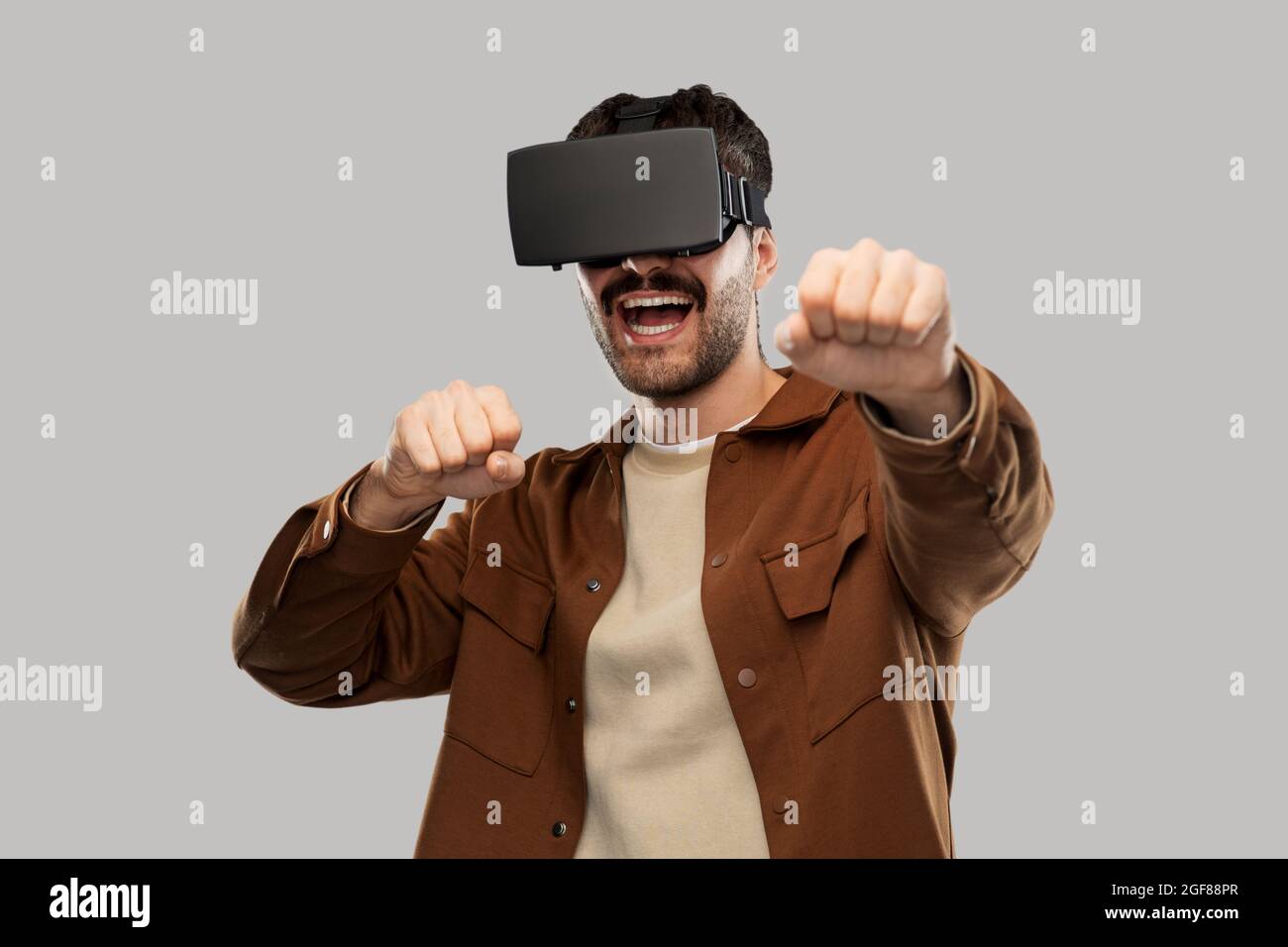 happy smiling young man in vr glasses Stock Photo - Alamy