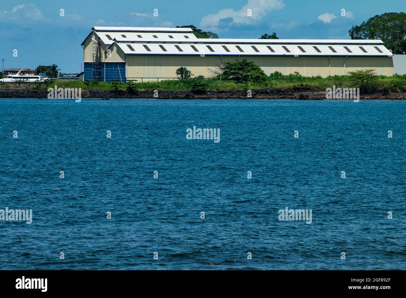 a seaside industrial warehouse with Atlantic Ocean in the foreground ...
