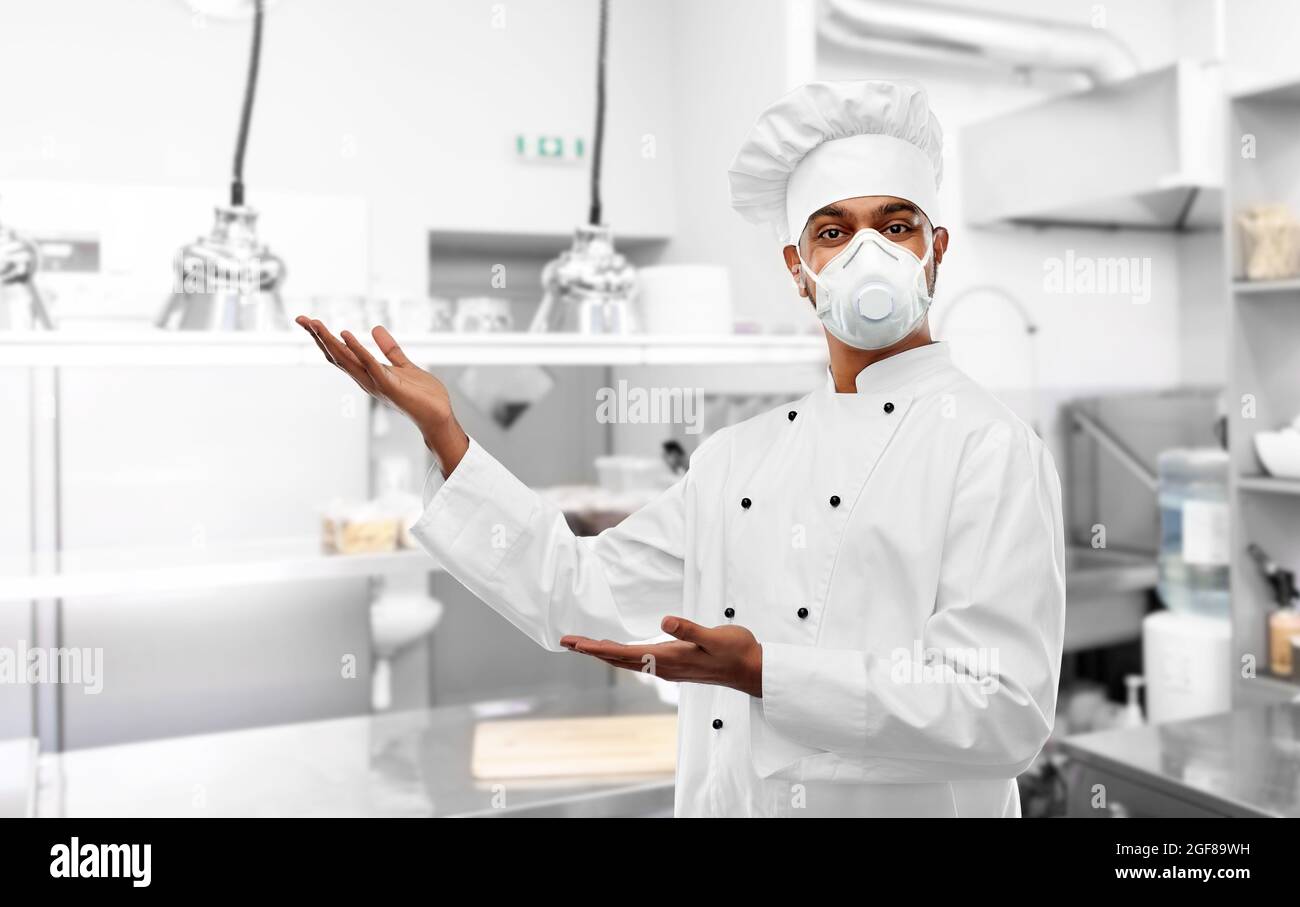 male chef in respirator at restaurant kitchen Stock Photo - Alamy