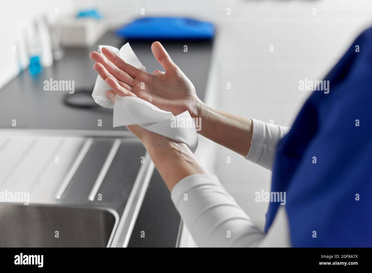 doctor or nurse drying hands with paper tissue Stock Photo - Alamy