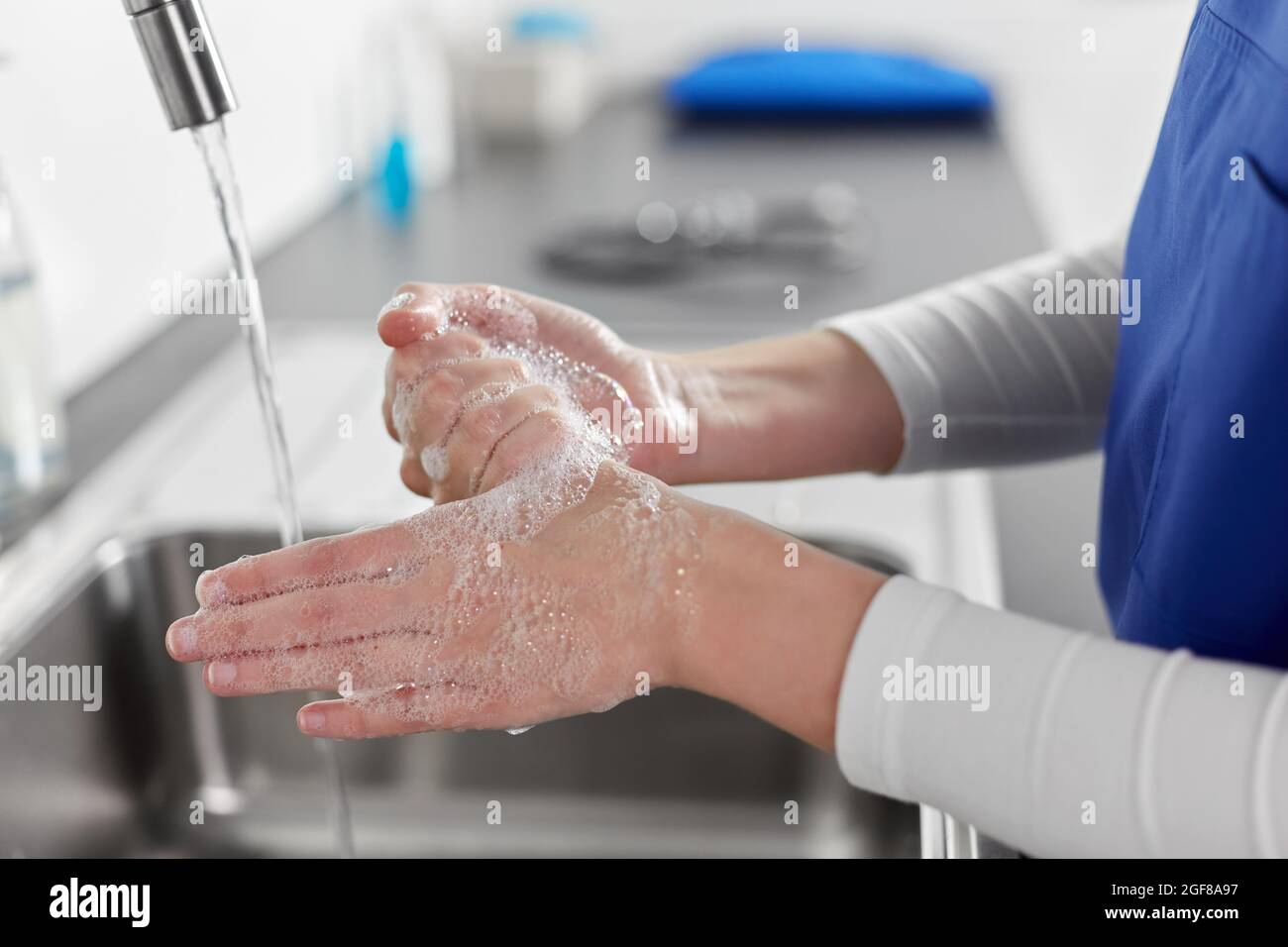 doctor or nurse washing hands with liquid soap Stock Photo - Alamy