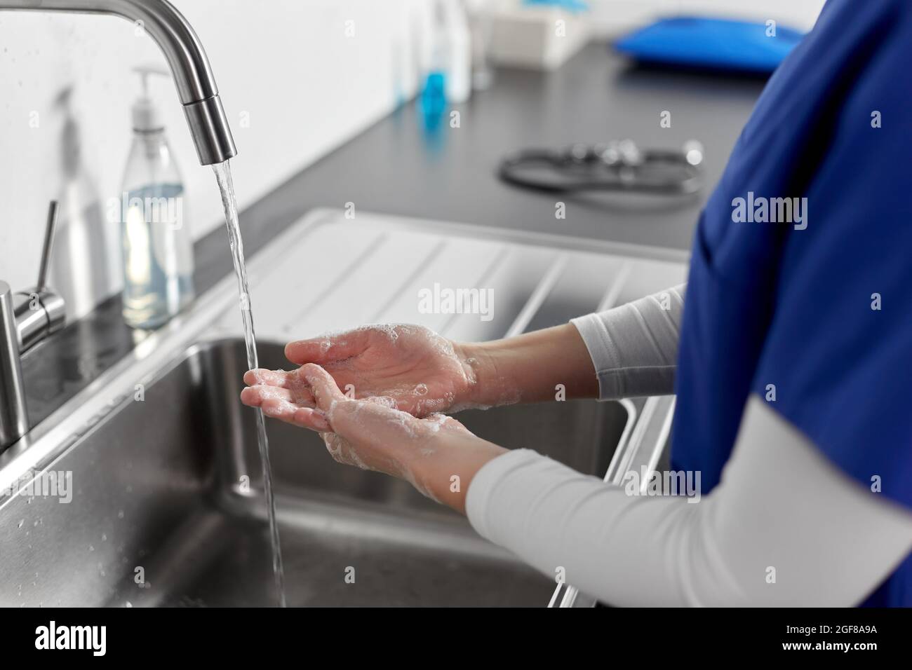 doctor or nurse washing hands with liquid soap Stock Photo - Alamy