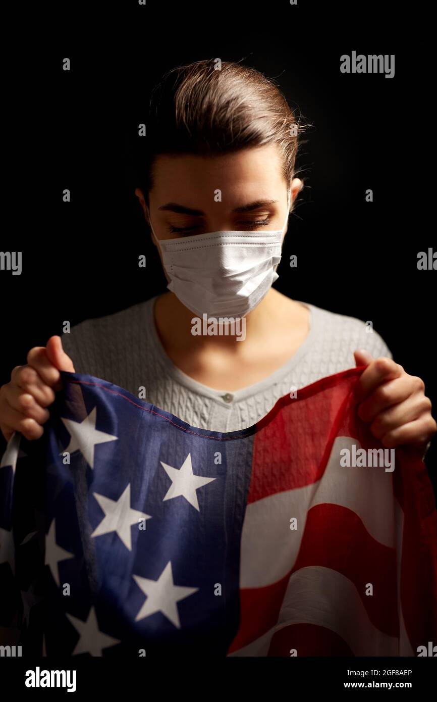 Woman in face mask holding hi-res stock photography and images - Alamy