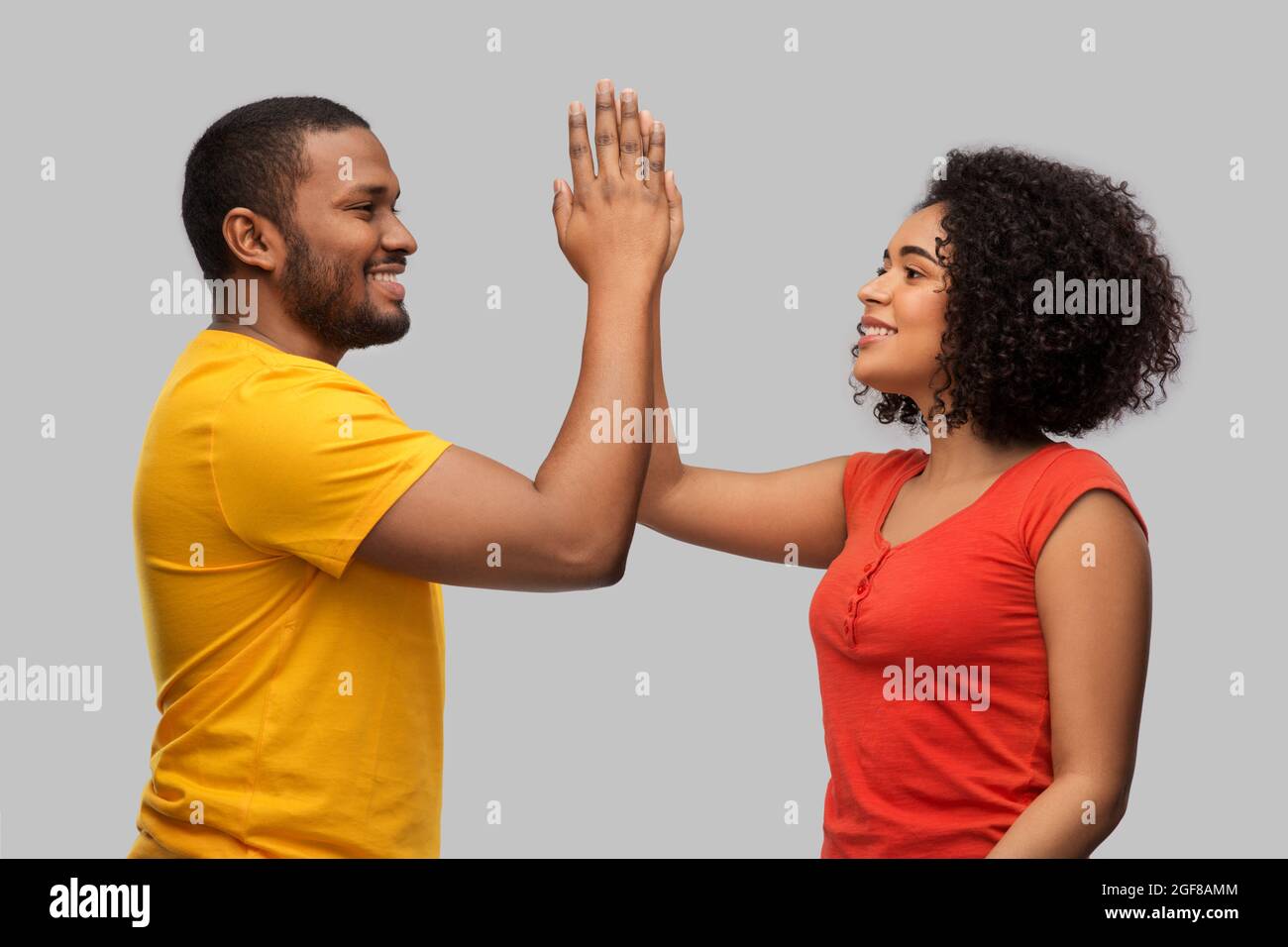 Couple making high five hi-res stock photography and images - Alamy