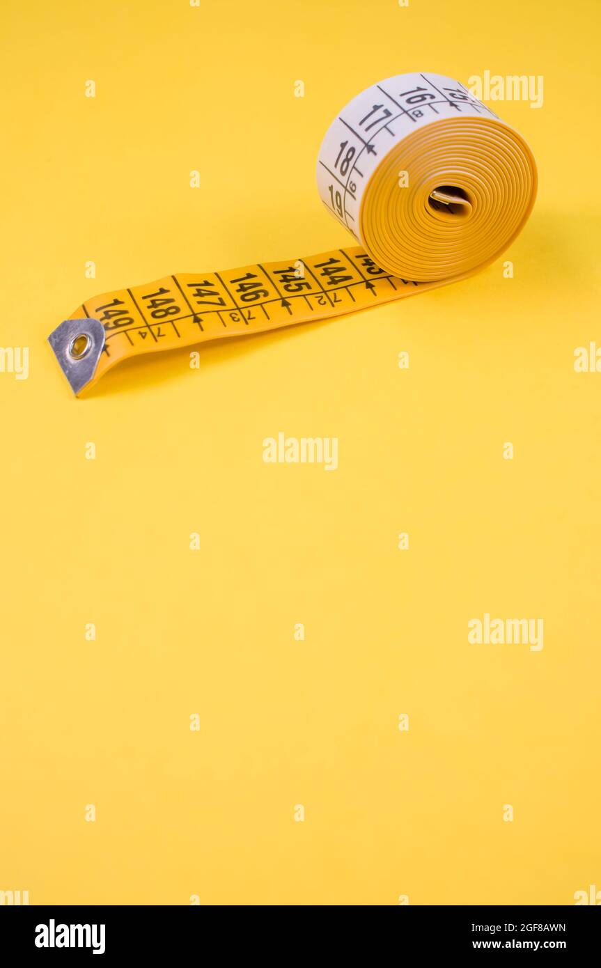 Close up of a meter roll isolated on a yellow background , with Stock ...