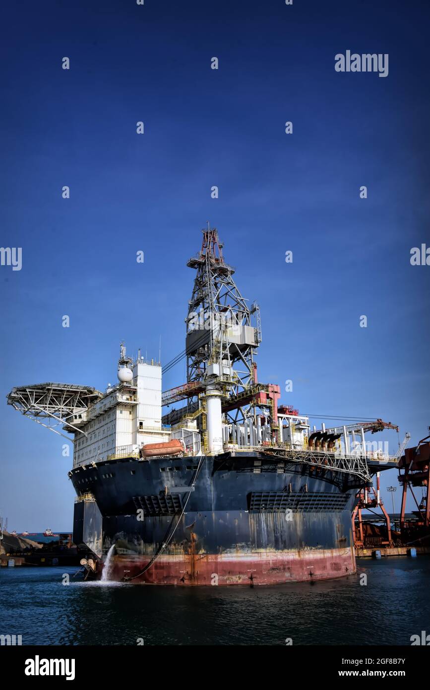 circular round shape FPSO alongside at port for maintenance and survey ...