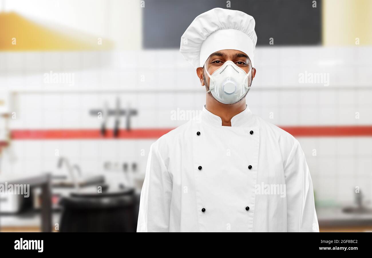 male chef in respirator at restaurant kitchen Stock Photo - Alamy