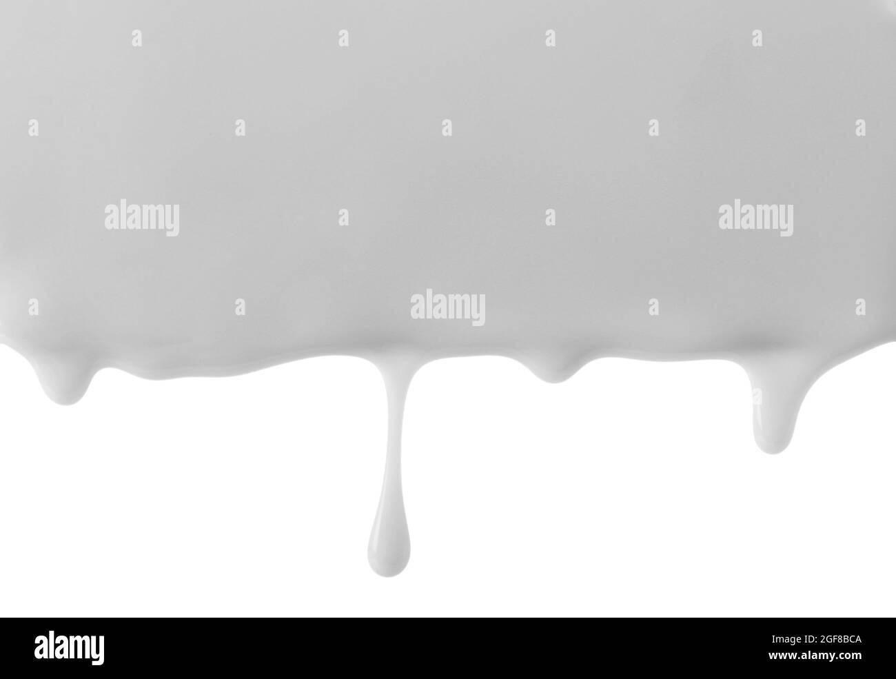 Flows milk, isolated on white Stock Photo - Alamy