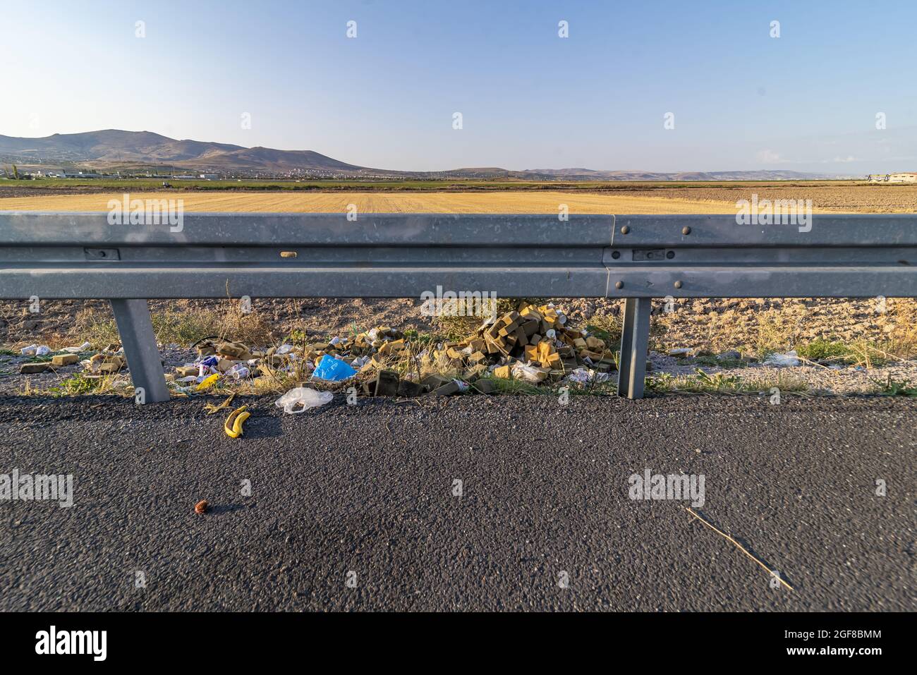Environmental pollution on highway sides. household waste Stock Photo ...