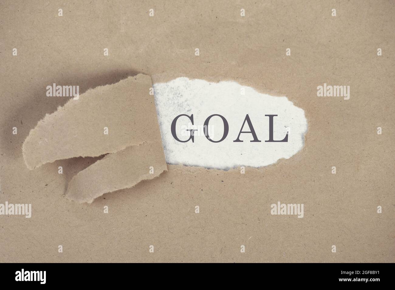 The word goal is standing on a white background, ripped paper Stock ...