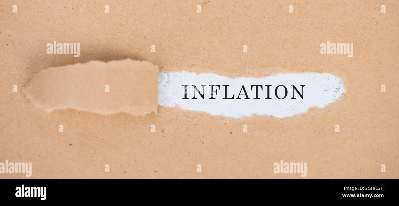 The word inflation is standing on a white background, ripped paper ...
