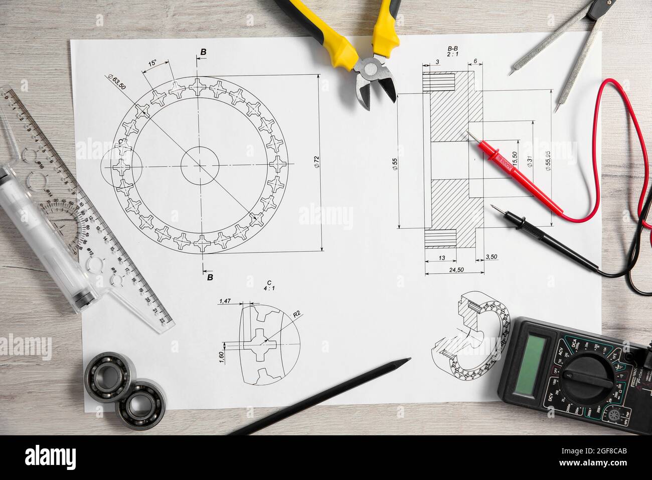 Project drawing and digital multimeter top view Stock Photo - Alamy