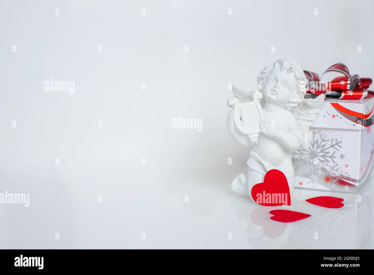 ceramic angel and gift box Stock Photo - Alamy