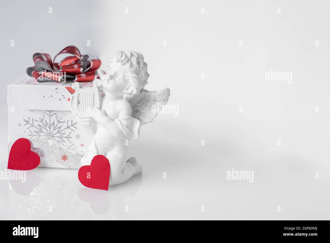 ceramic angel and gift box Stock Photo - Alamy