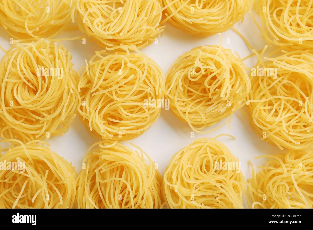Bird's nests pasta background, top view Stock Photo - Alamy