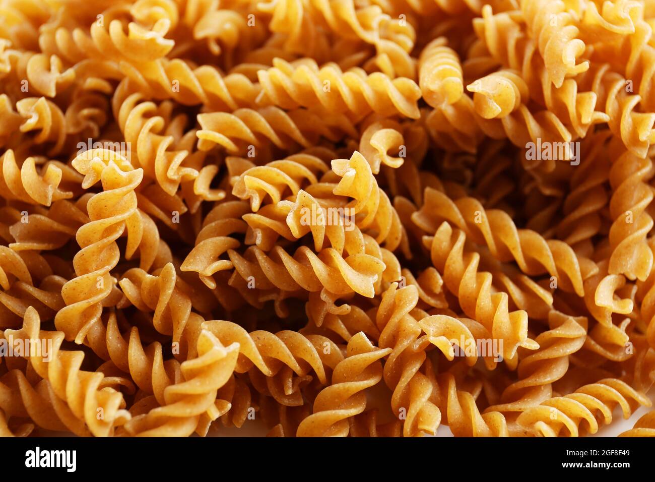 Brown Italian dry pasta background, close up Stock Photo - Alamy