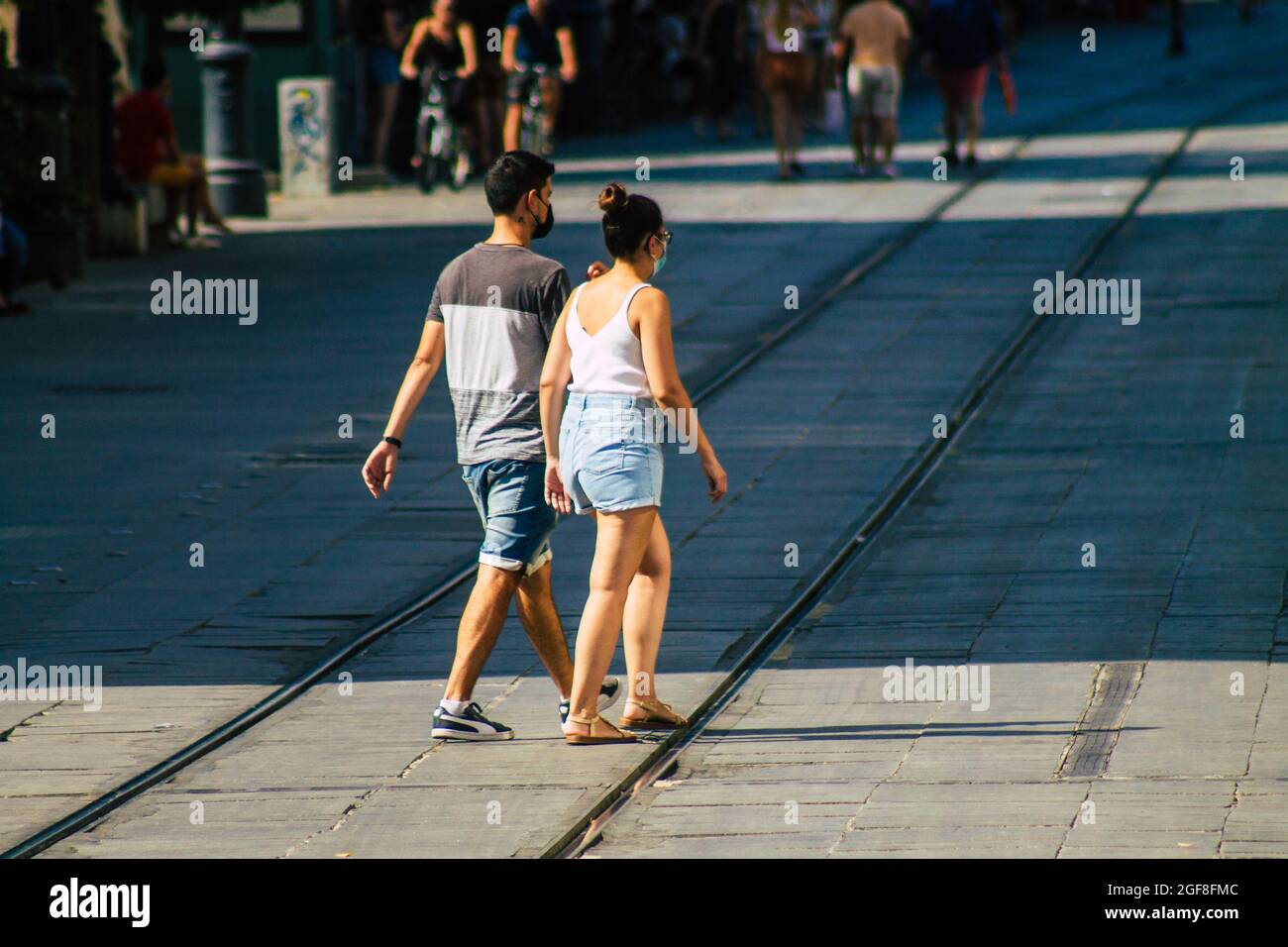 Seville Spain August 21, 2021 Tourists walking in the streets of ...