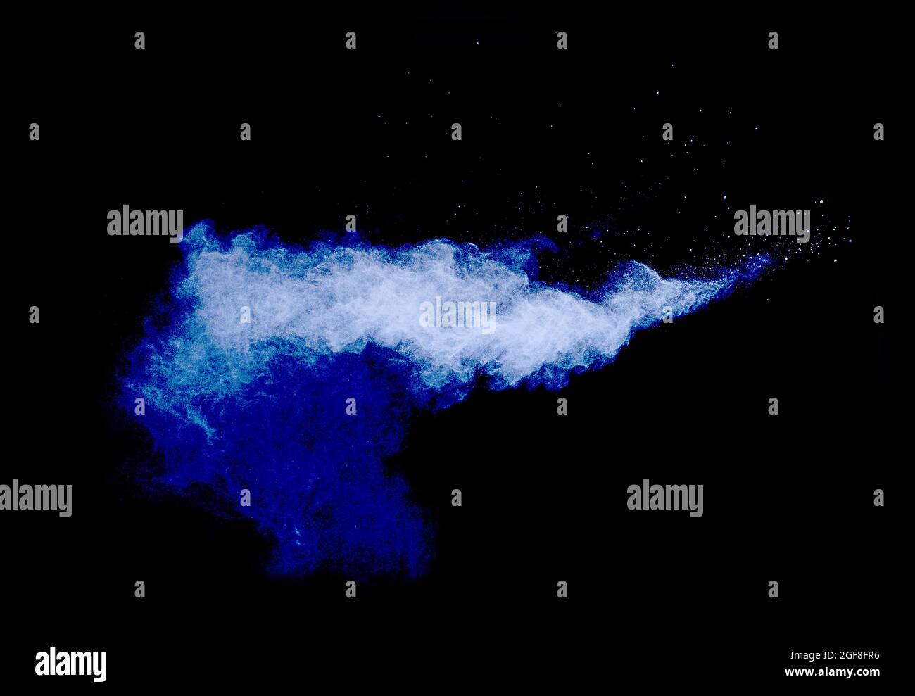 Cloud of powder on dark blue background Stock Photo - Alamy