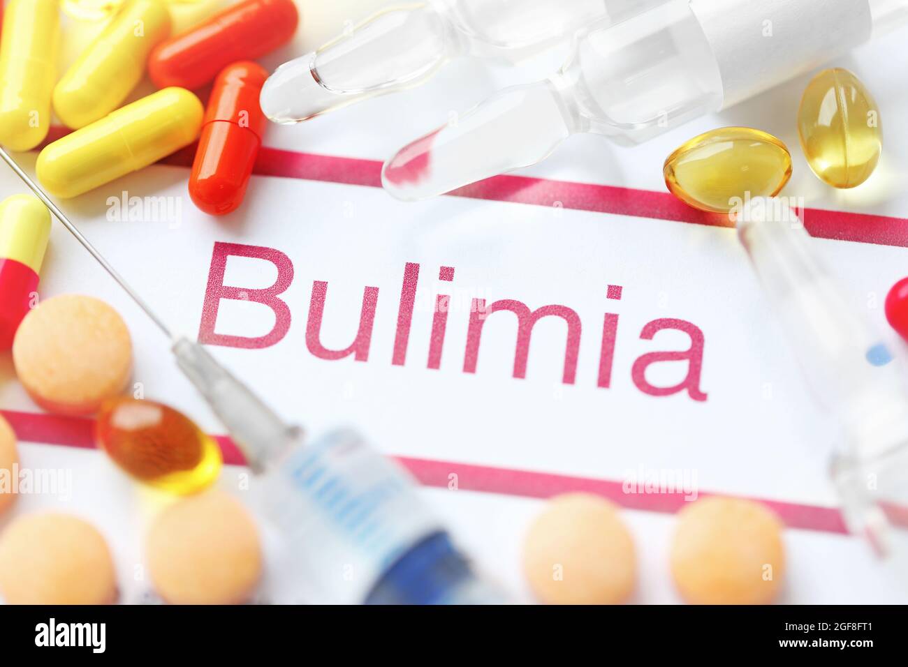 Medicines and Bulimia diagnosis written on paper closeup Stock Photo ...