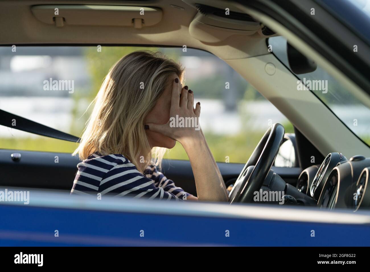 Anxious woman driver in car suffer panic attack cry. Frustrated unhappy ...