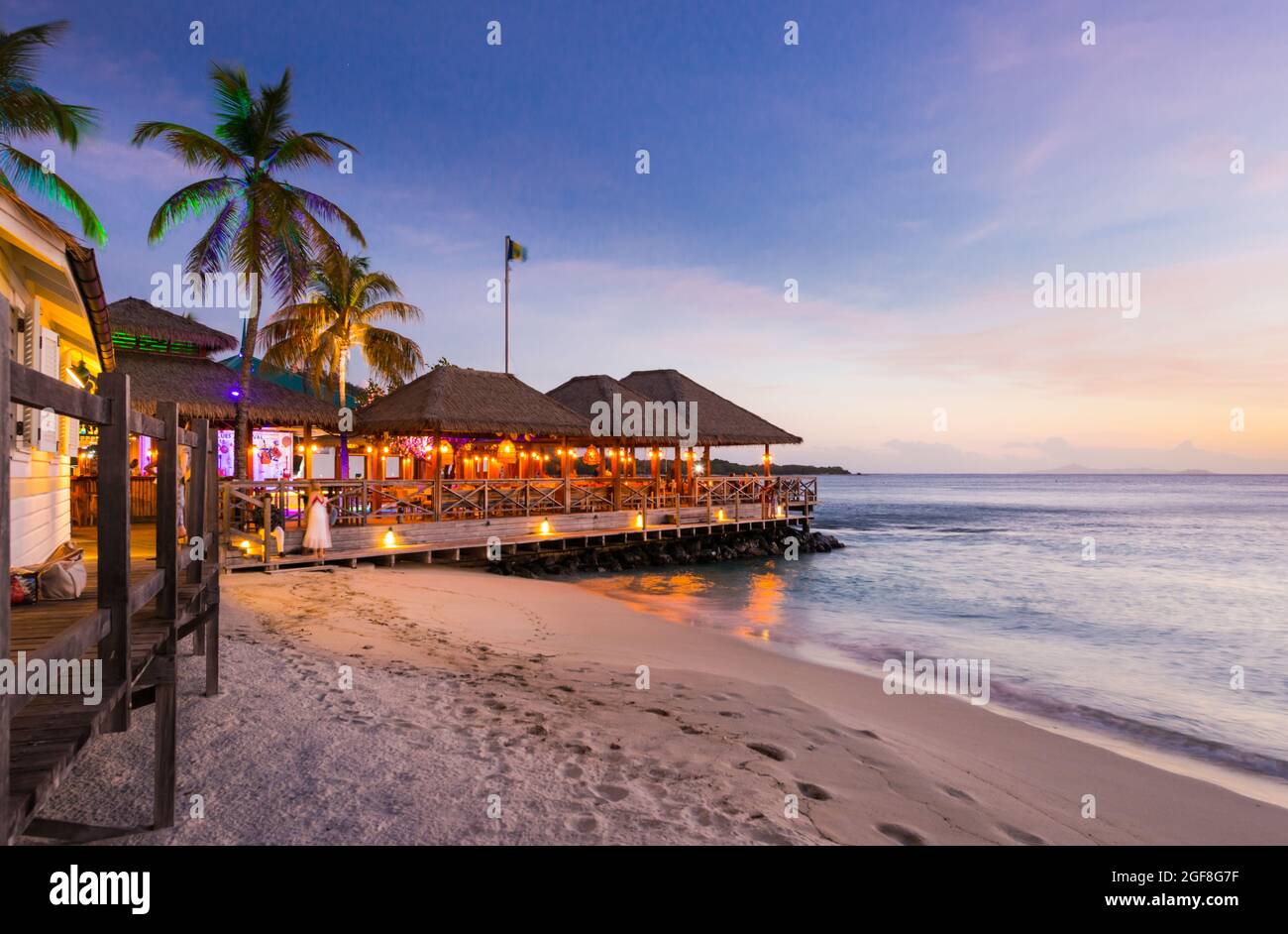 basils bar mustique at night from beach Stock Photo - Alamy