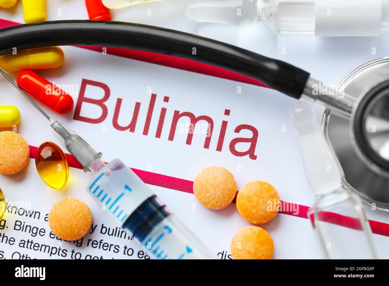 Medicines and Bulimia diagnosis written on paper closeup Stock Photo ...