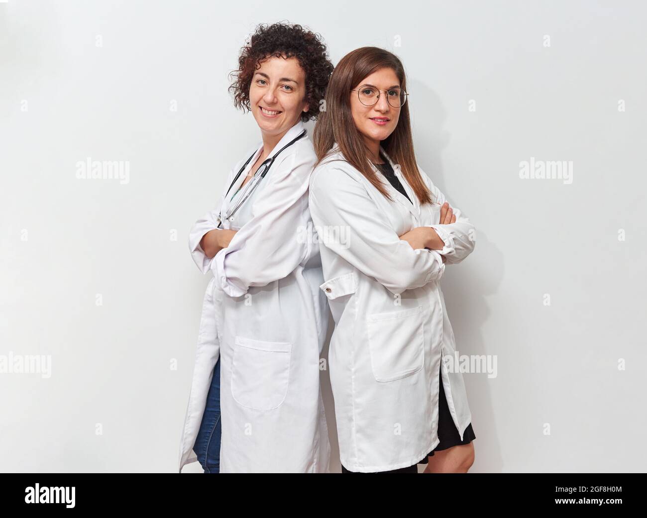 Doctor standing back hi-res stock photography and images - Alamy