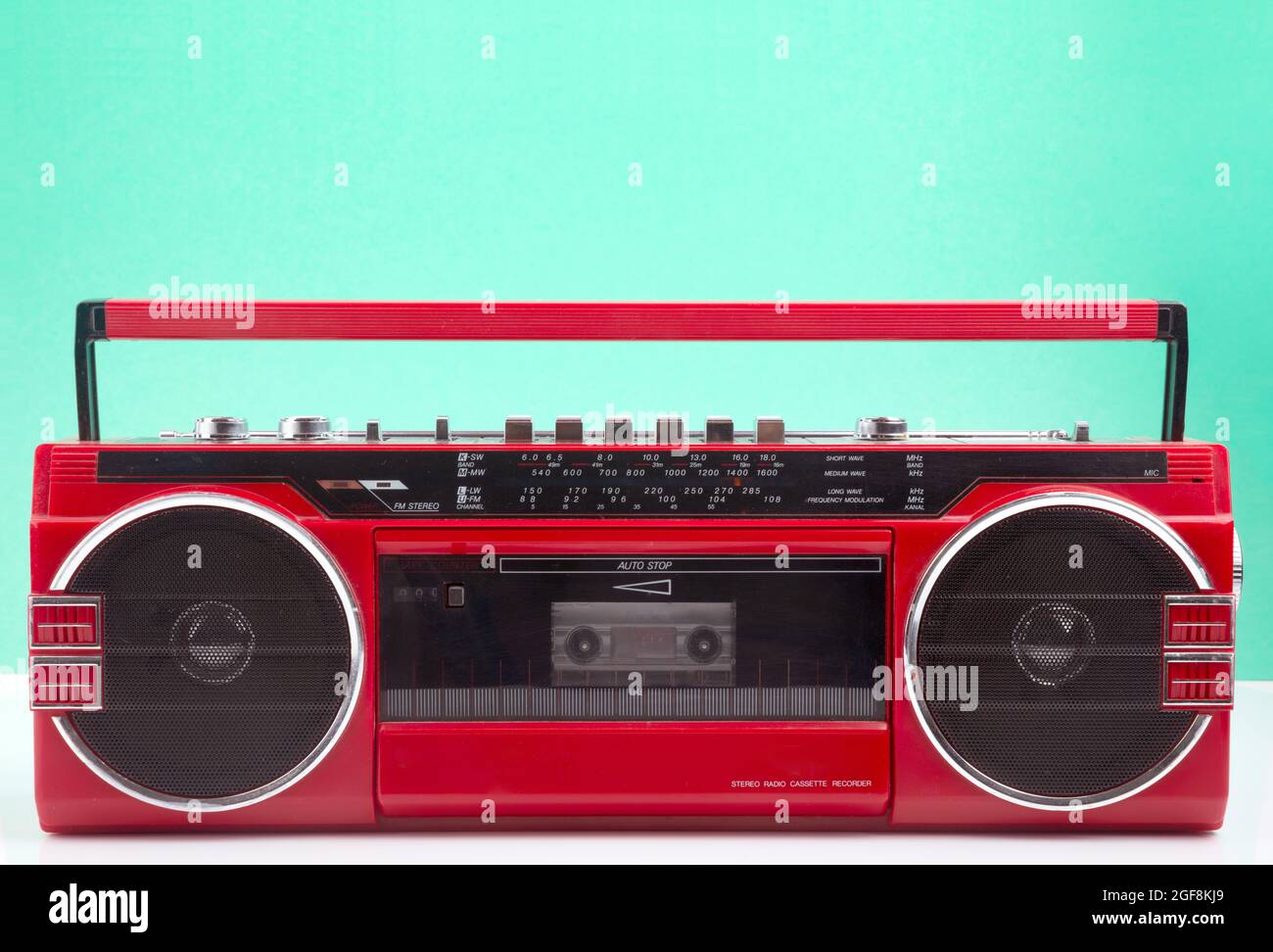 Red vintage Tape player isolated on green and white background Stock ...