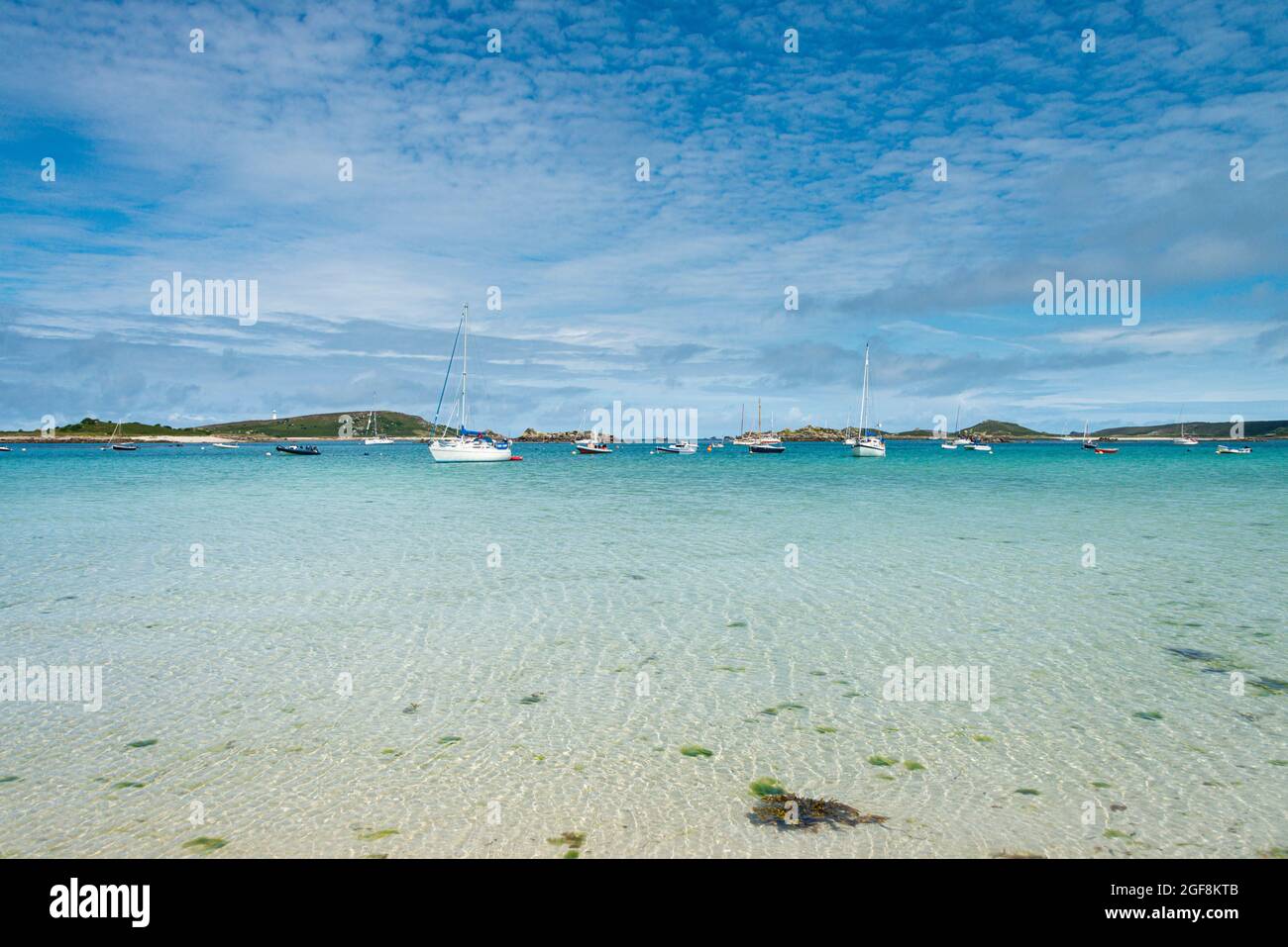 Boats anchored in Old Grimsby Harbour, Tresco, Isles of Scilly Stock ...