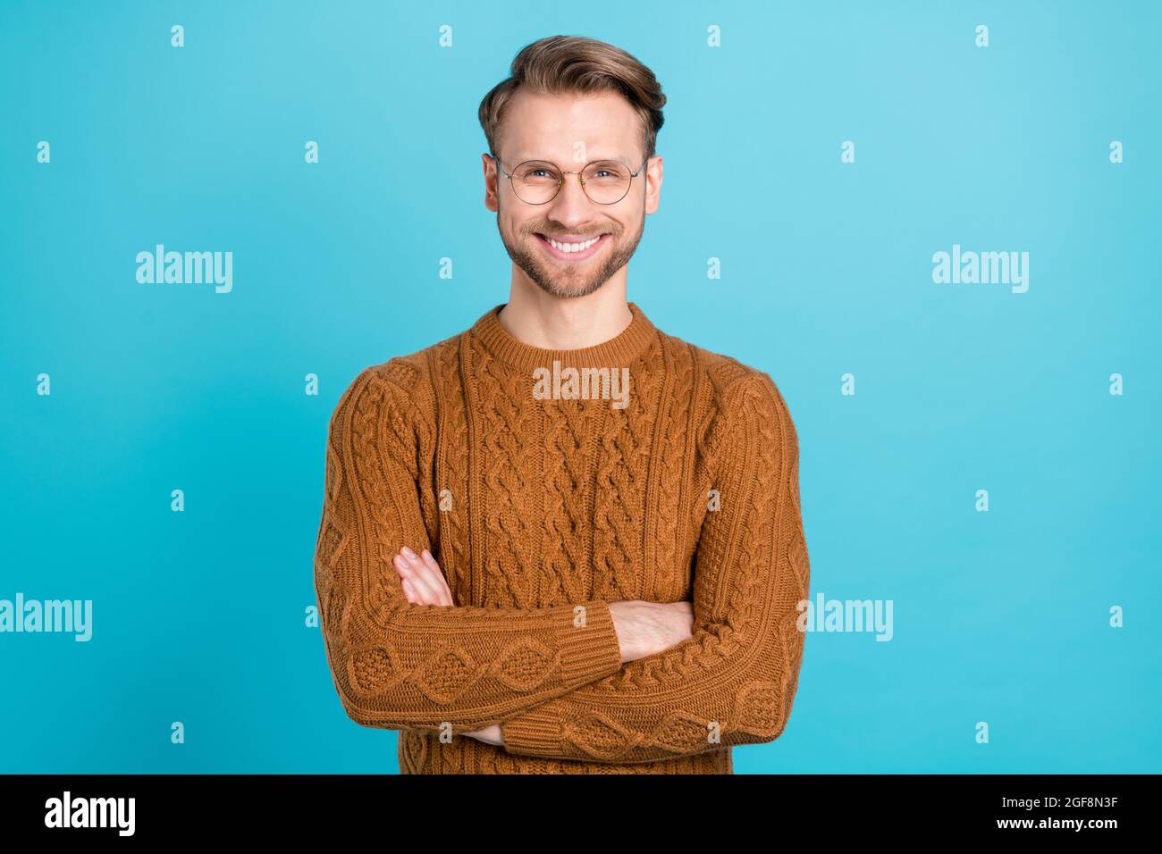 Photo of charming young confident man hold hands crossed wear glasses ...
