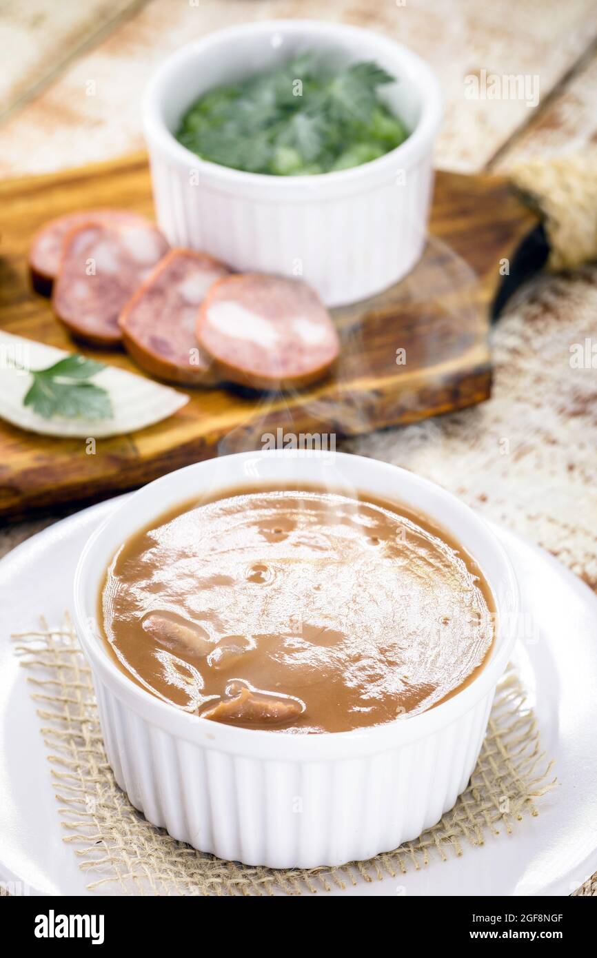 Brazilian bean broth, homemade bean soup served warm in winter, with ...
