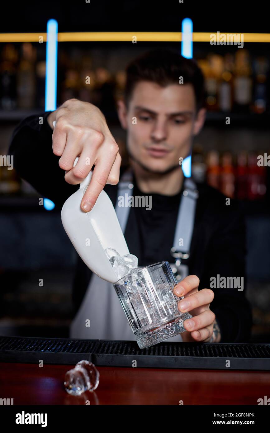 Barman pours transparent drink cocktail hi-res stock photography and images - Alamy